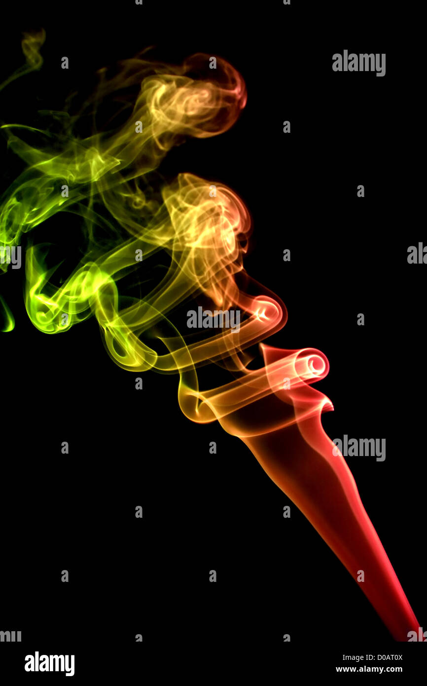 Colored red smoke, isolated on black background Stock Photo - Alamy