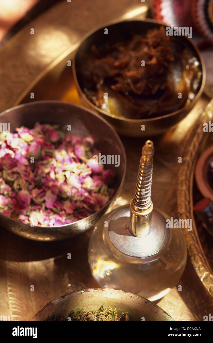 BOWL OF DRIED ROSEBUDS FROM THE DADES FLASK OF ROSEWATER AND A BOWL OF ...