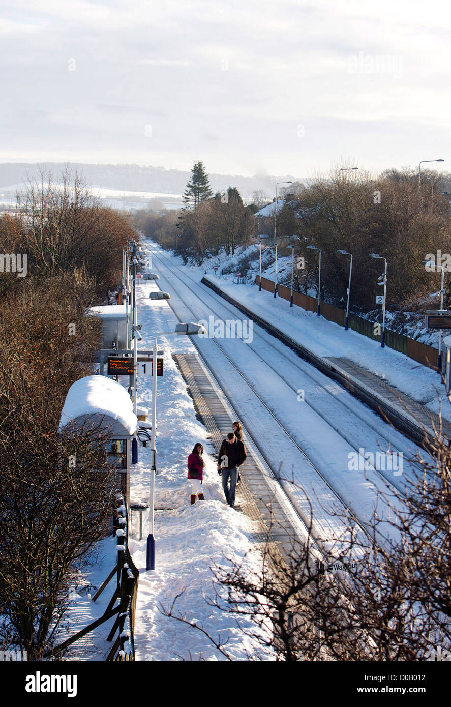 People waiting for delayed trains at the station due the bad weather ...