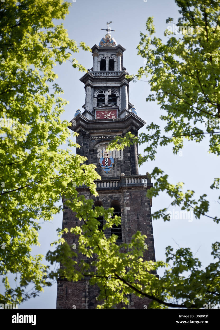 A photo of famous Westerkerk in Amsterdam (Westertoren in Jordaan) next ...