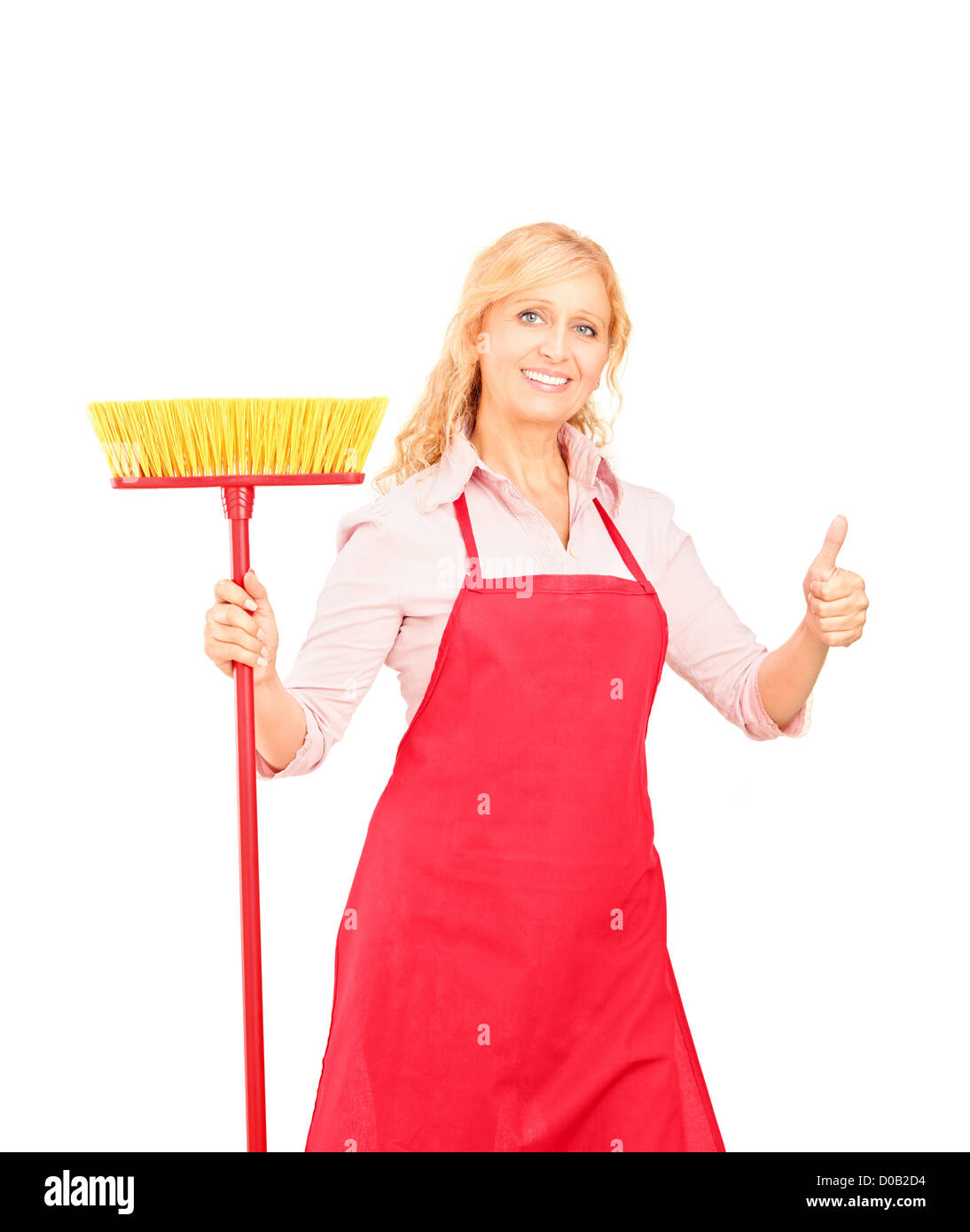 A female cleaner posing with brush and giving thumb up isolated on ...
