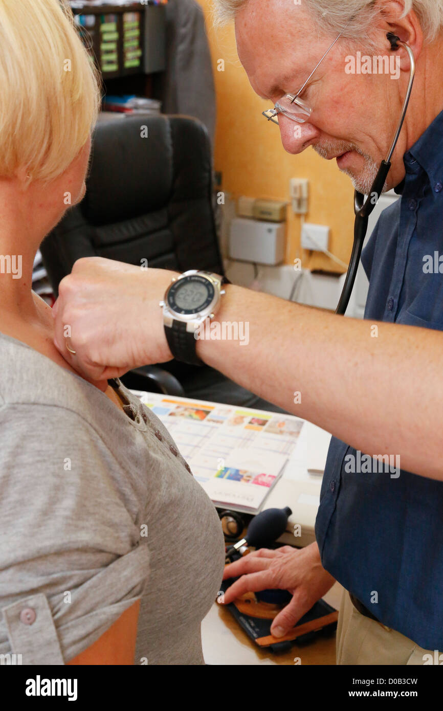 Auscultation woman cardiac hi-res stock photography and images - Alamy