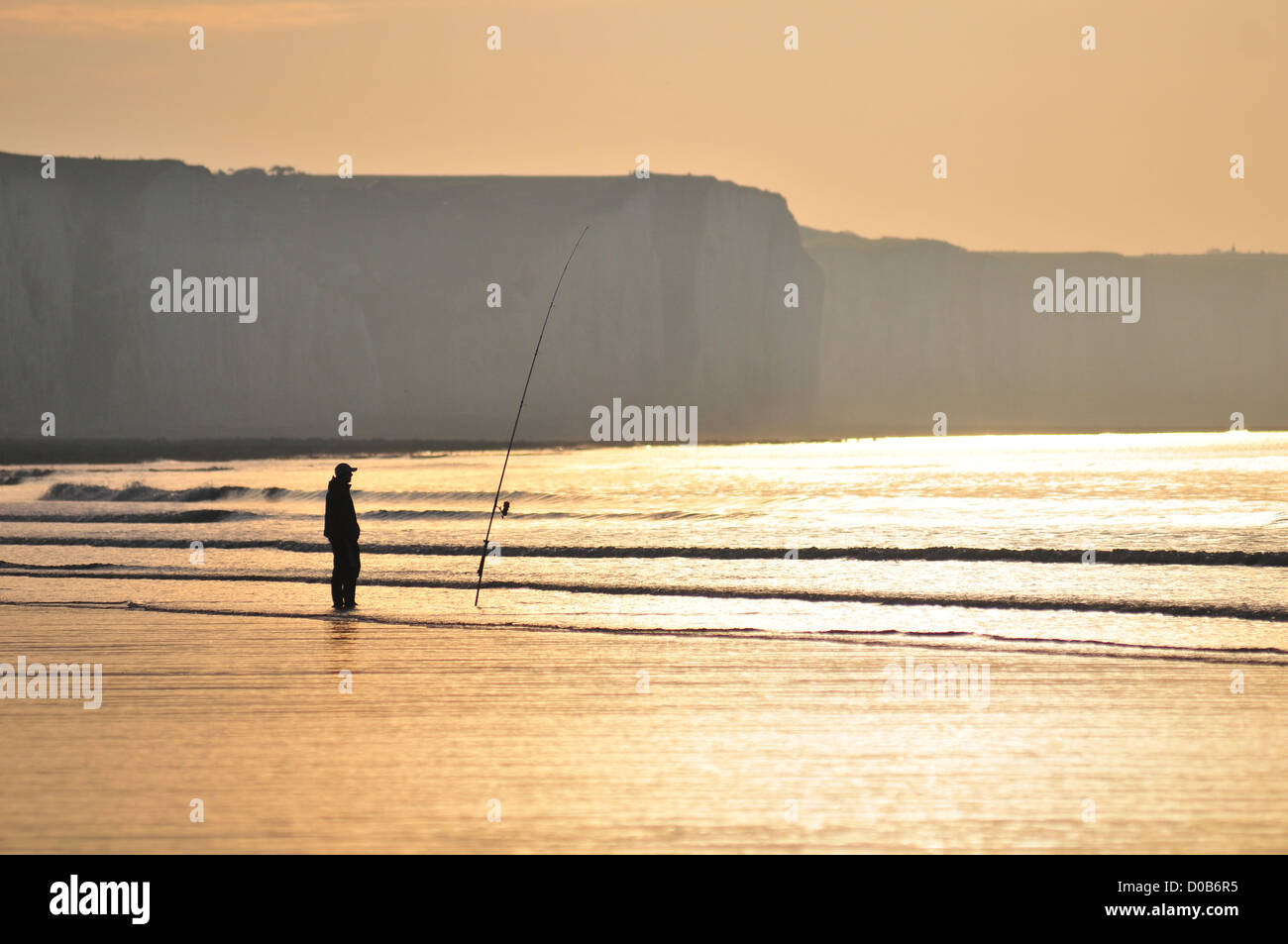 FISHER NEAR THE CLIFFS OF AULT AT SUNSET BAY OF SOMME SOMME (80) FRANCE ...