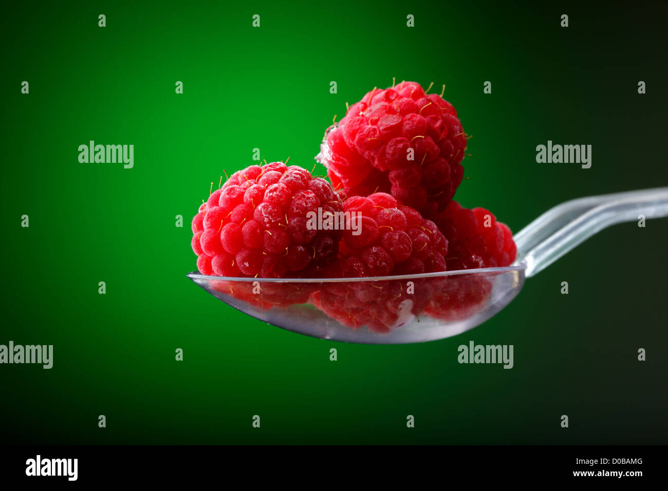 A spoon with raspberry Stock Photo - Alamy