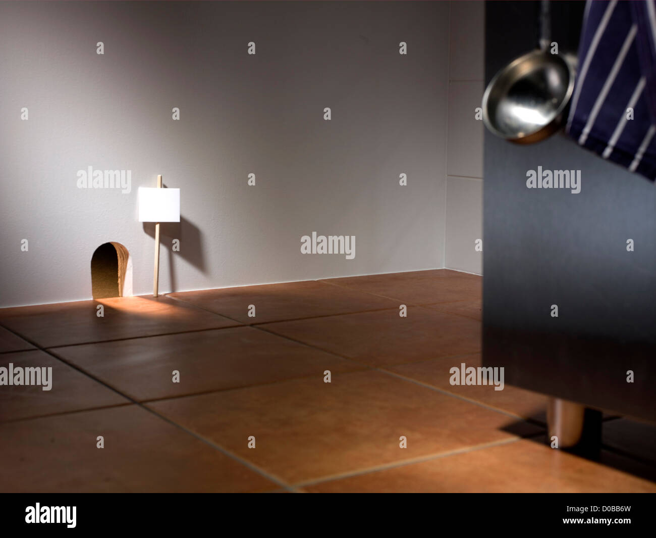 mouse hole with blank signpost in a commercial kitchen Stock Photo - Alamy