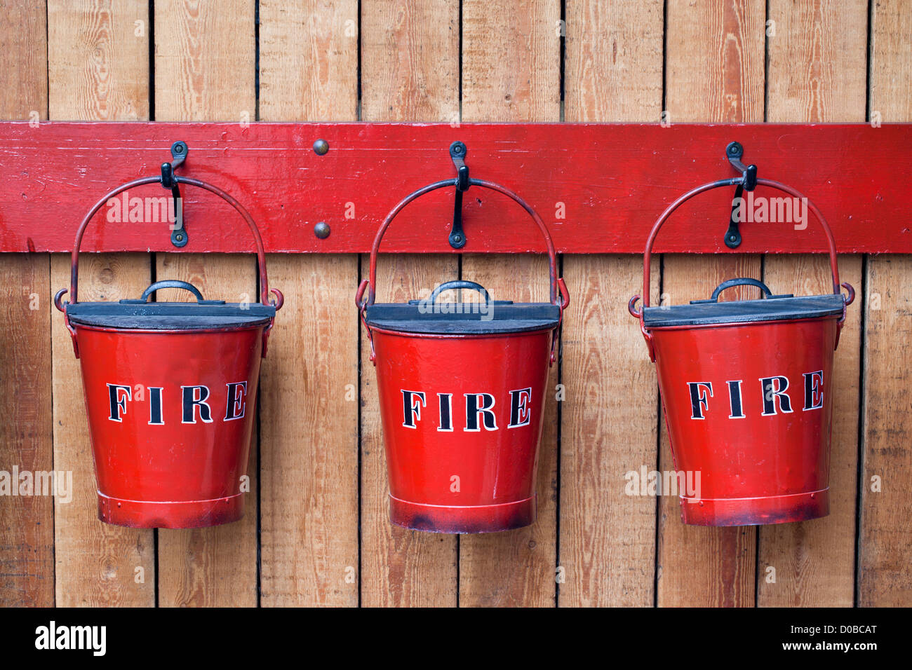 Red portable fire buckets hi-res stock photography and images - Alamy