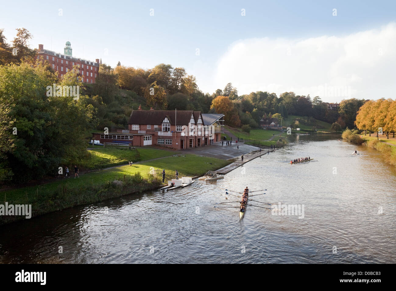 River Severn at Shrewsbury in autumn, with school, boathouse and rowing ...