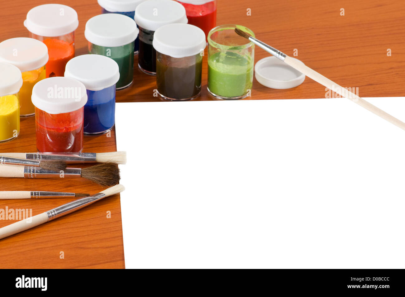paints with brushes and empty white paper sheet Stock Photo - Alamy