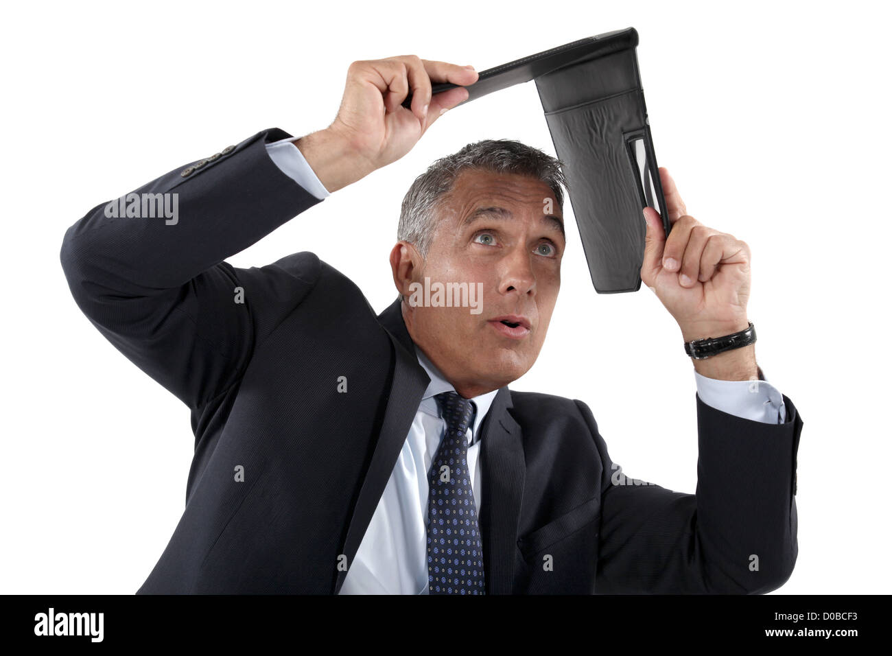 Businessman shielding himself with folder Stock Photo - Alamy