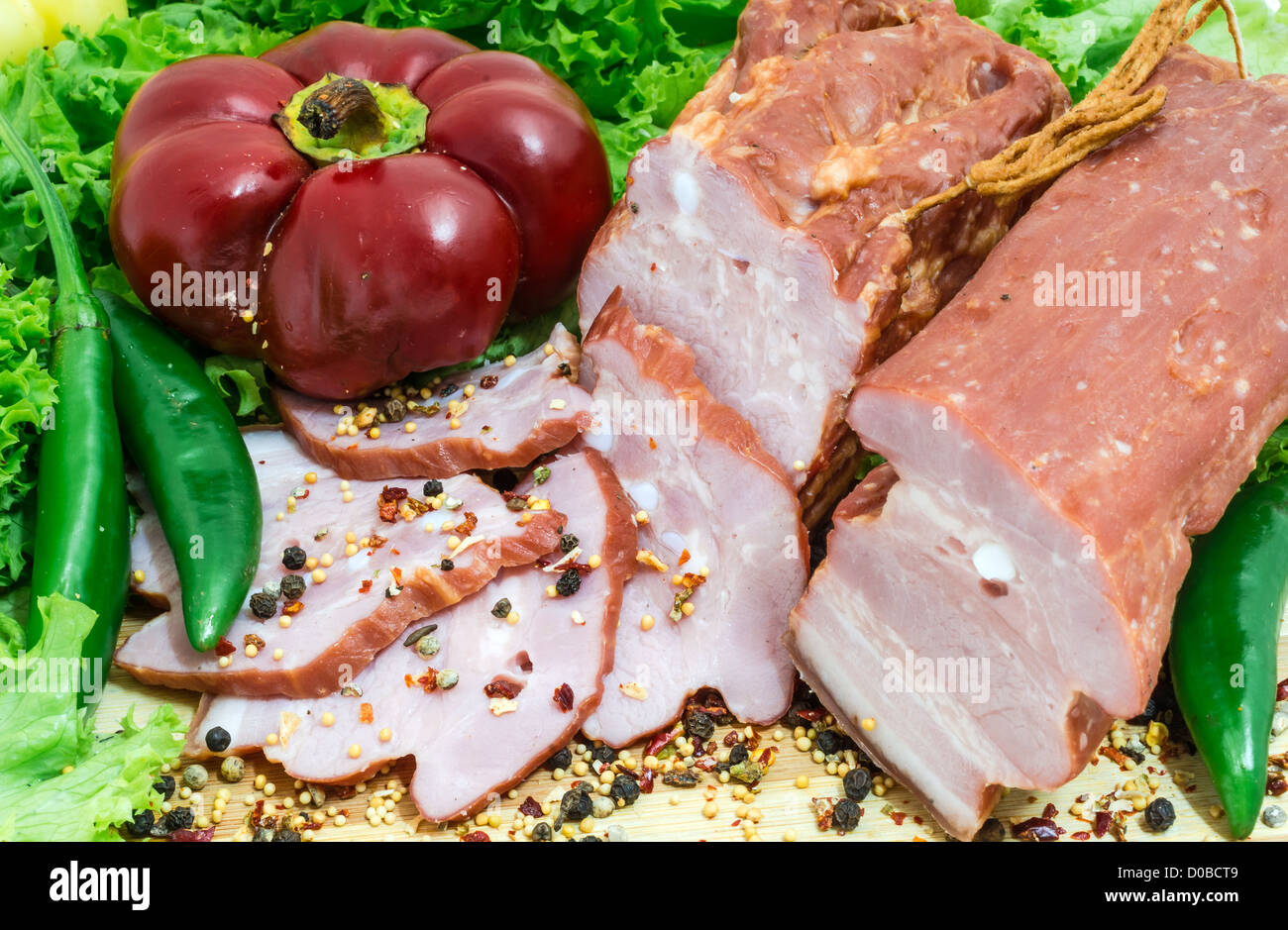 Still life with sliced romanian bacon and vegetables Stock Photo - Alamy
