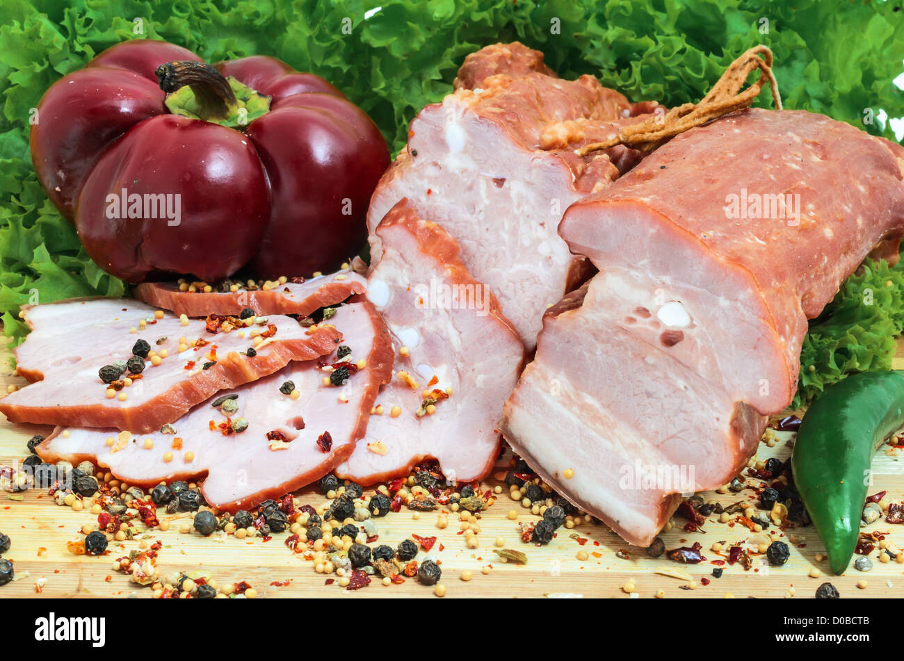 Still life with sliced romanian bacon and vegetables Stock Photo - Alamy
