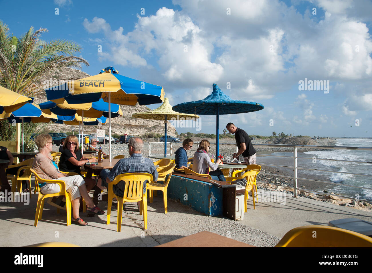 Beach cafe at Kourion Beach southern Cyprus Waiter serving customers ...