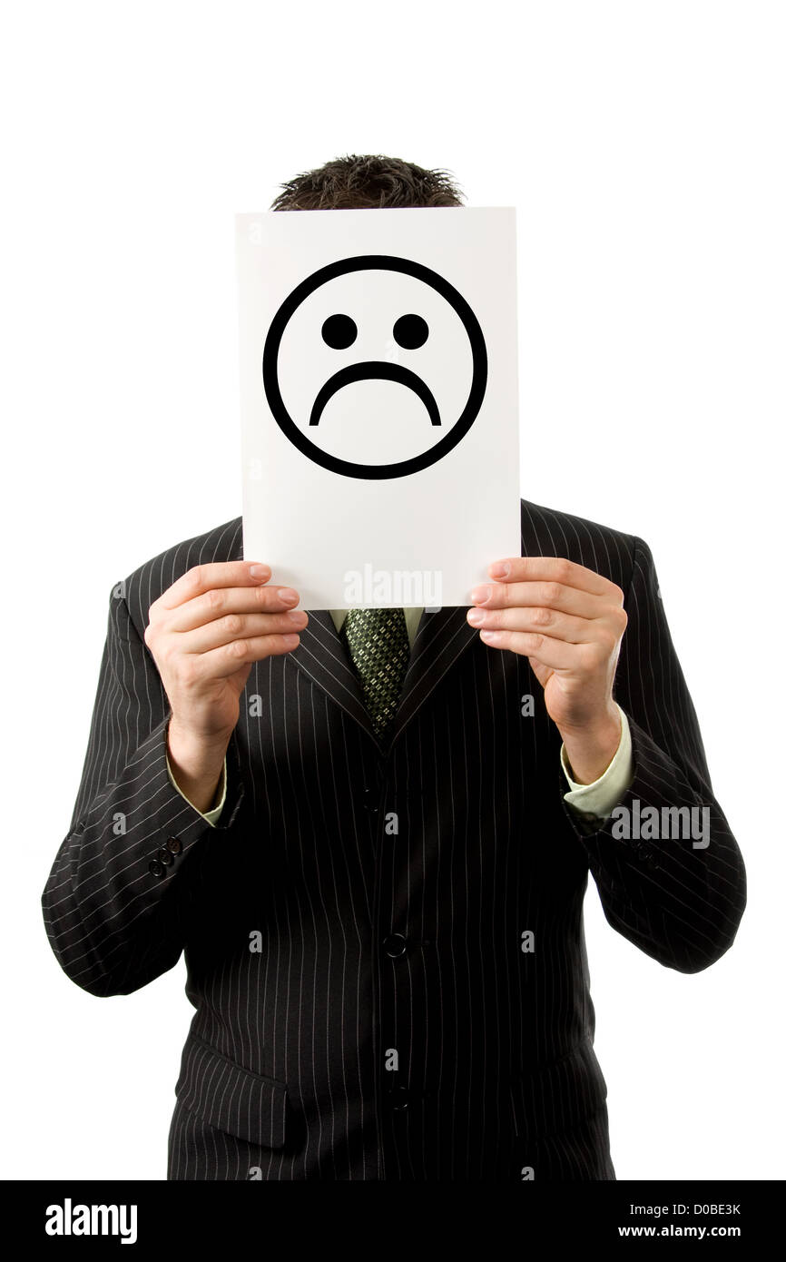 Businessman is holding a sad smiley Stock Photo - Alamy