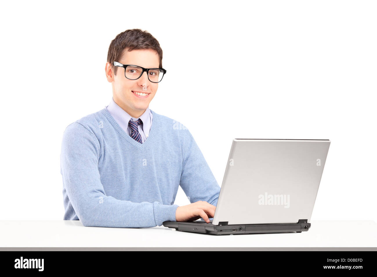 Smiling male working on a laptop isolated on white background Stock ...