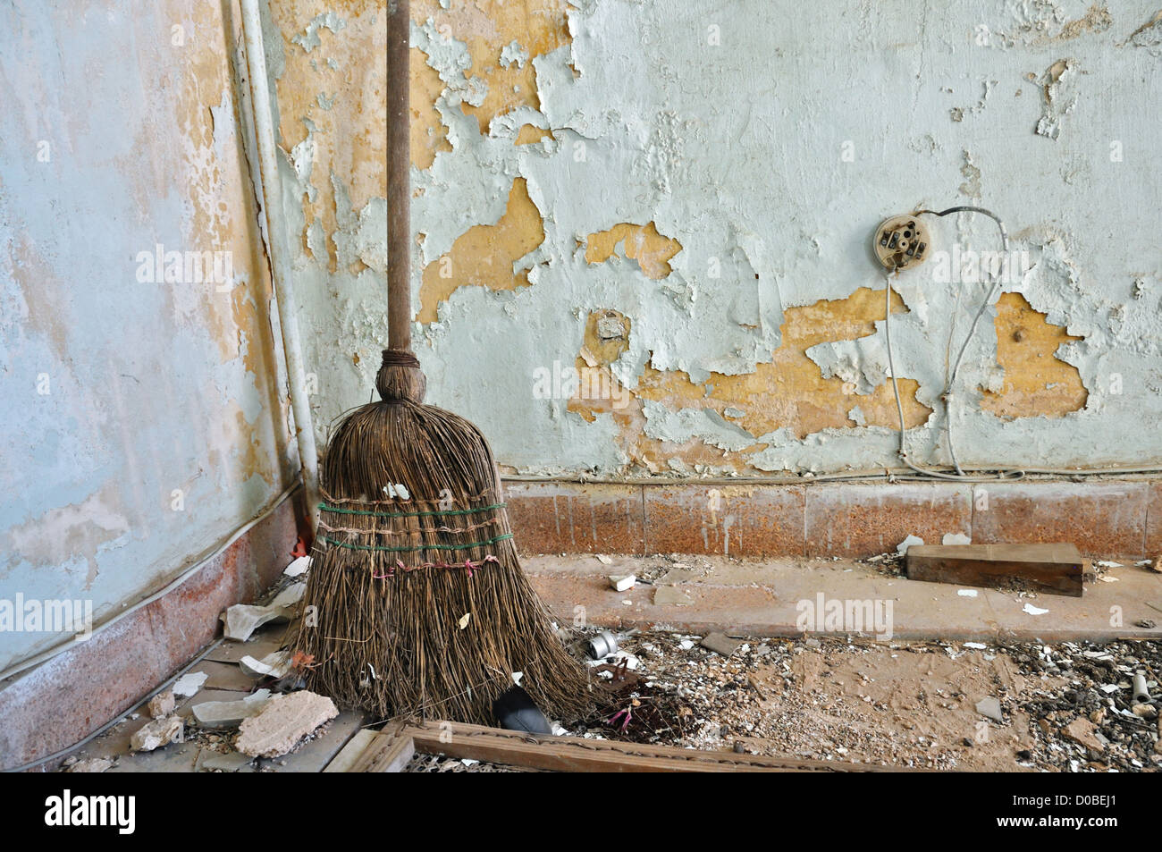 Dusty straw broom on filthy floor of abandoned house Stock Photo - Alamy