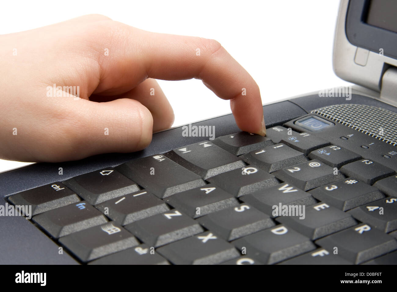 Finger is touching tje escape button on laptop Stock Photo - Alamy