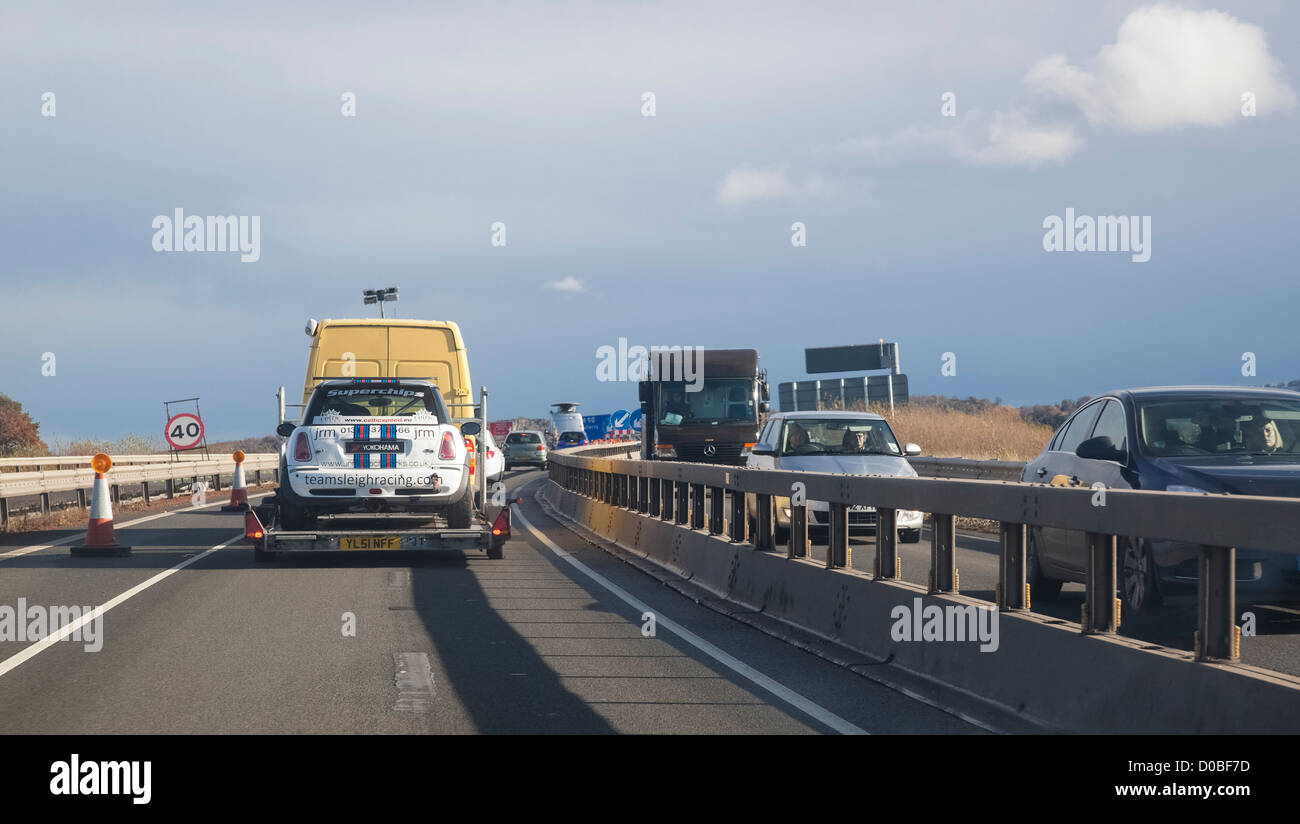 Traffic building at roadworks on a motorway on a sunny day Stock Photo ...