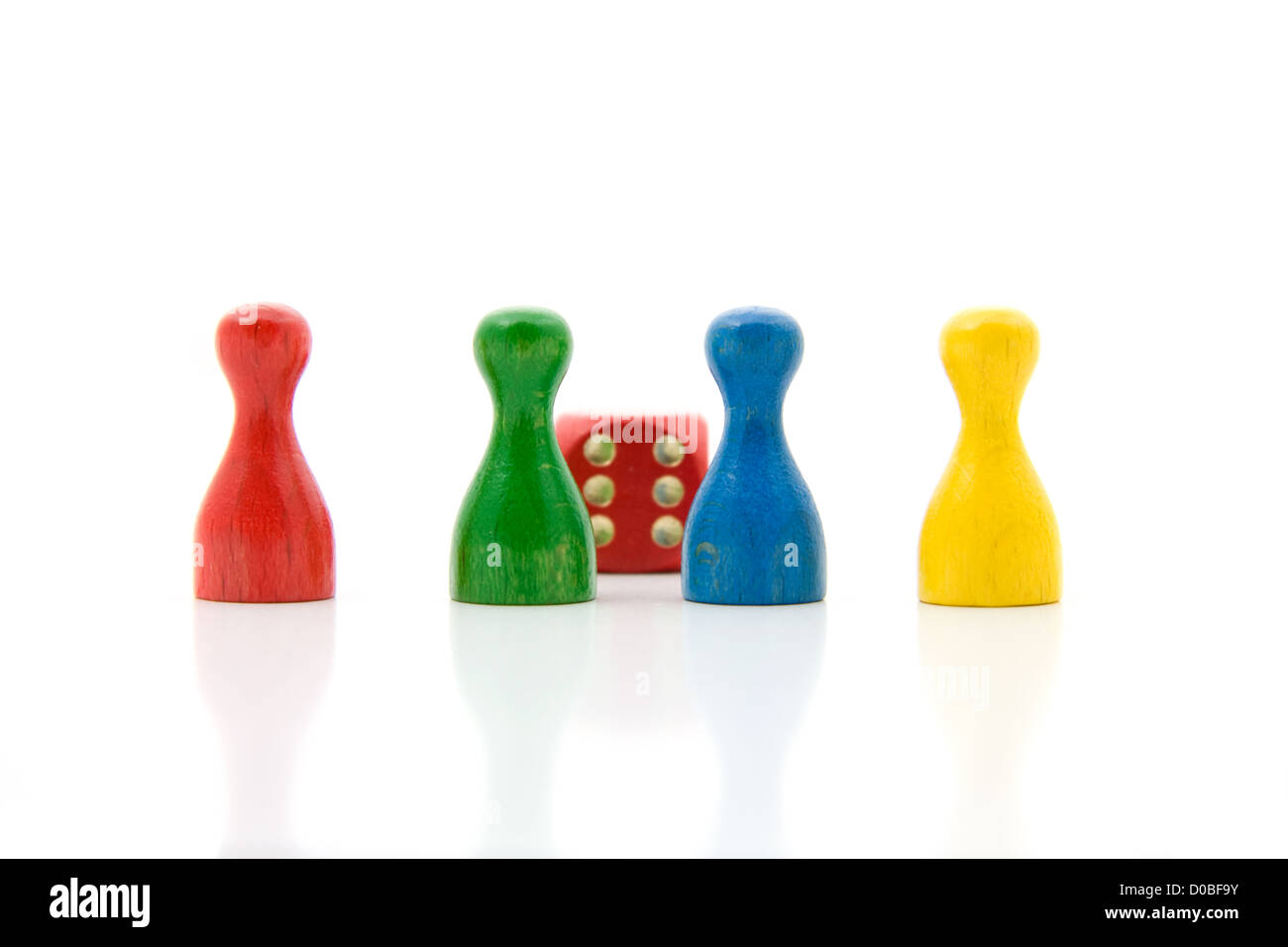 Four colored pawns with red dice, isolated on white background Stock ...