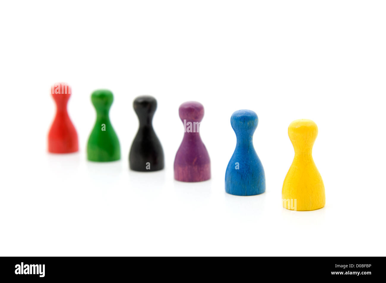 Four colored pawns isolated on white background Stock Photo - Alamy