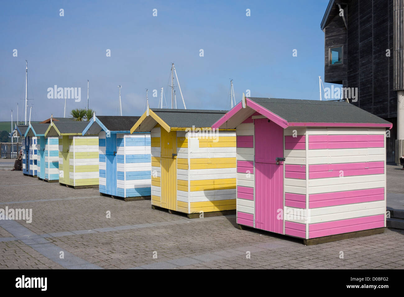 vibrant beach huts on display in sunshine Stock Photo - Alamy