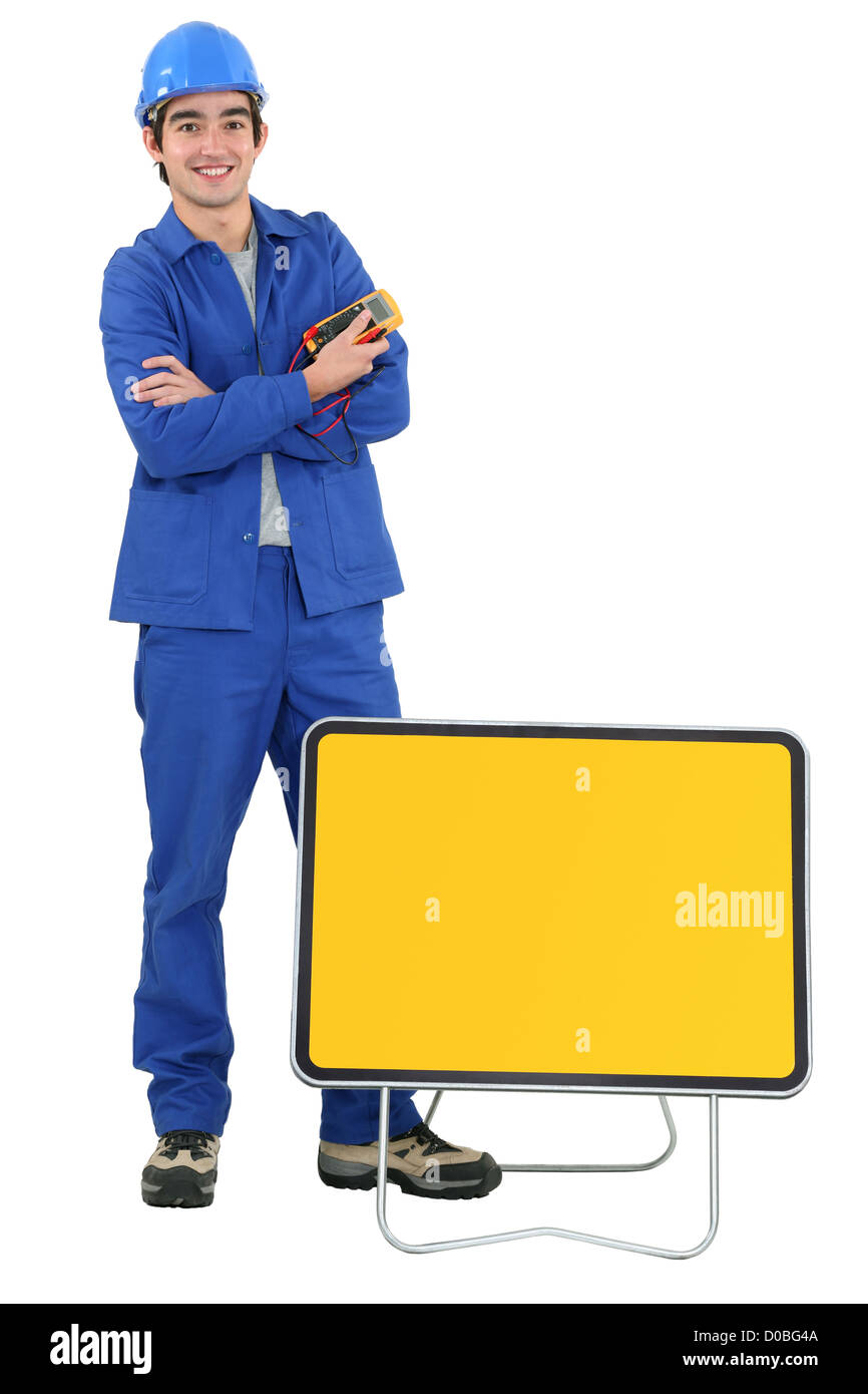 Tradesman with traffic sign Stock Photo - Alamy