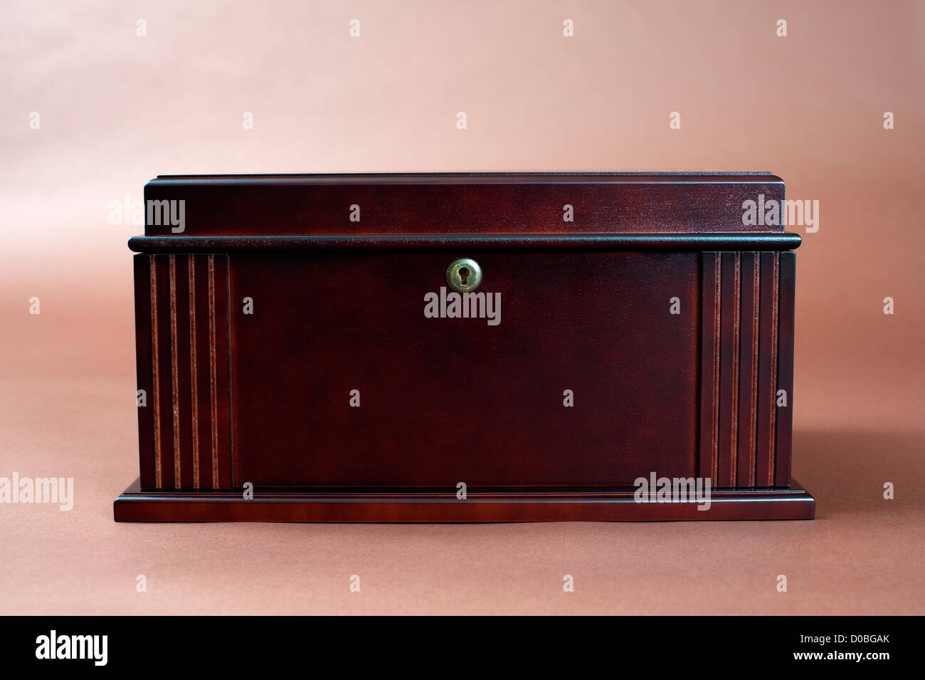 warm brown wood chest with brass keyhole Stock Photo - Alamy