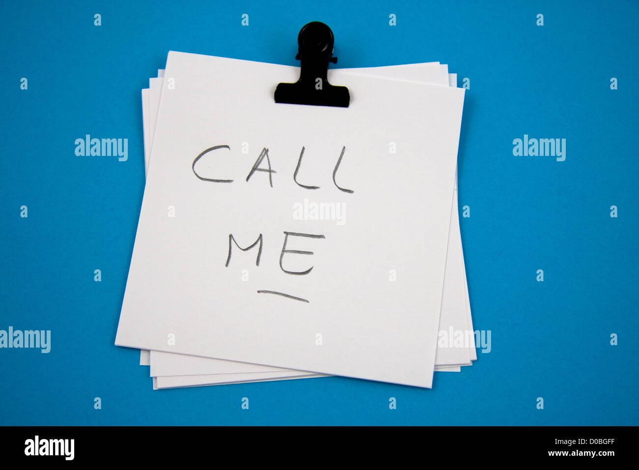 Notice paper with message, white on blue Stock Photo - Alamy