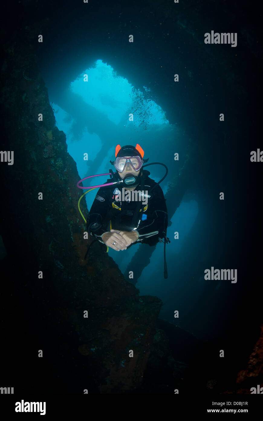 A diver swims inside the Uss Liberty Navy shipwreck in Tulamben,Bali ...