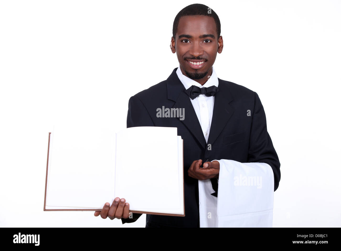 black waiter showing menu Stock Photo - Alamy