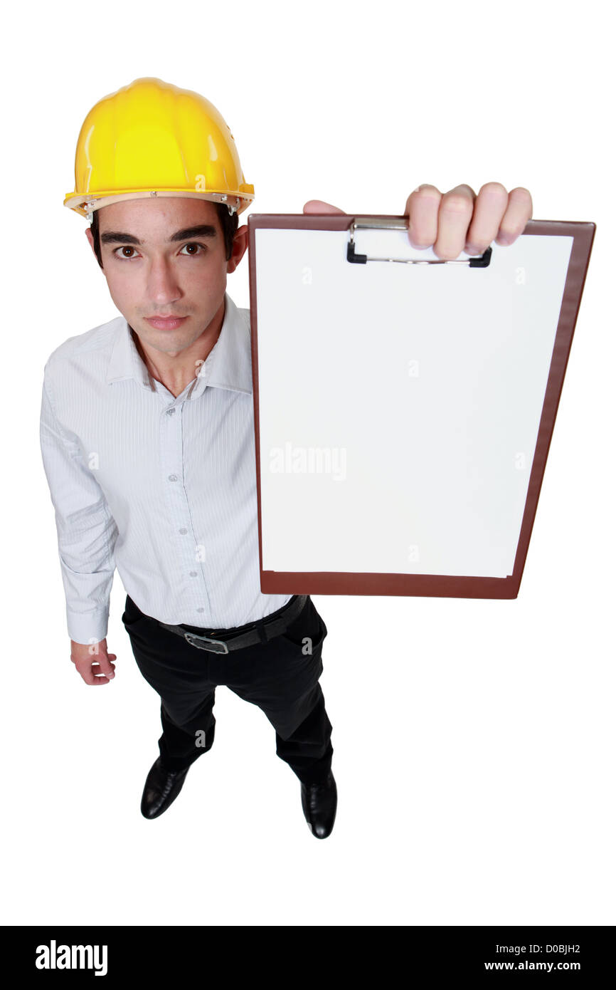 Engineer holding up a blank clipboard Stock Photo - Alamy