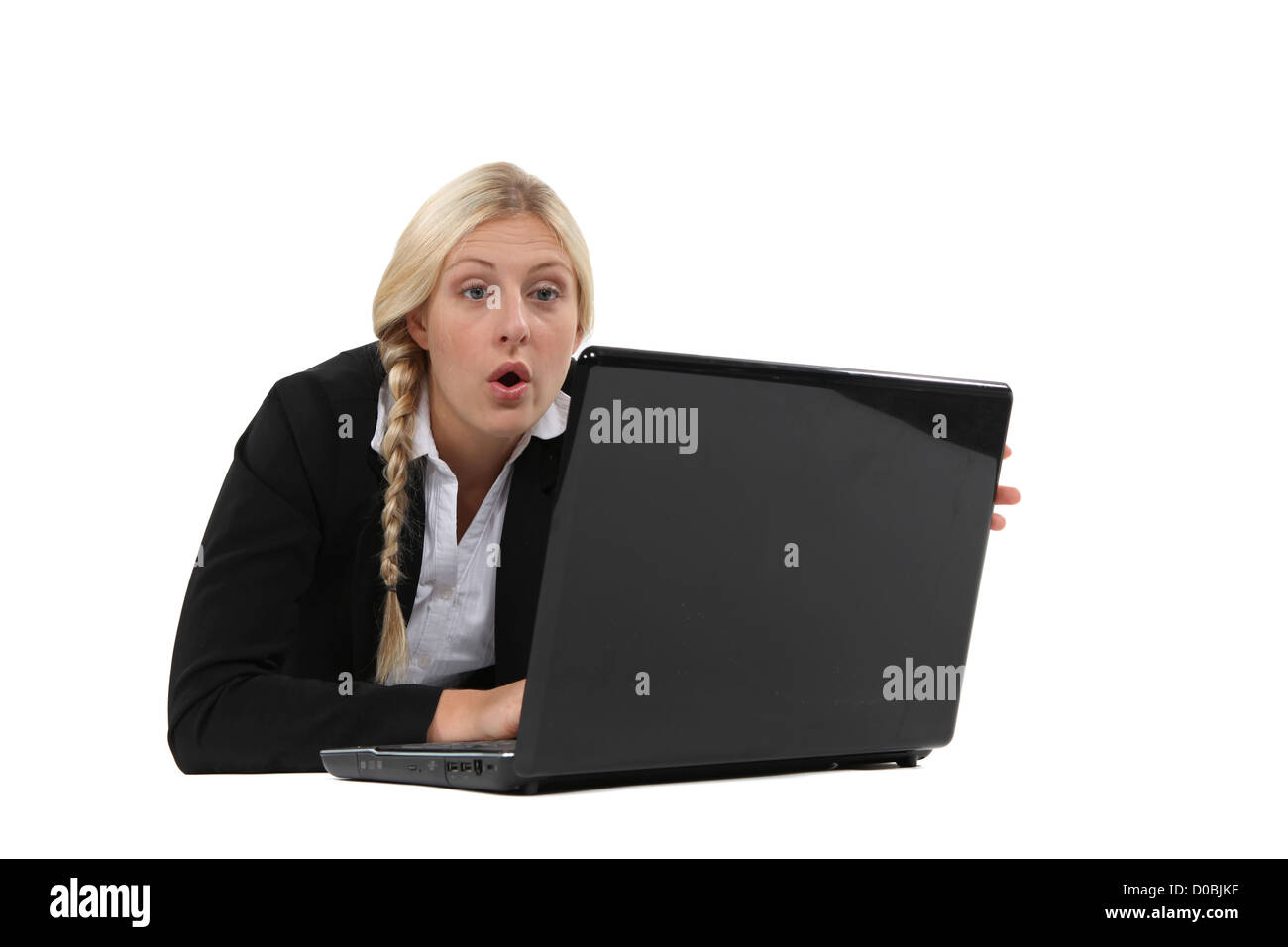 Woman surprised in front of a computer Stock Photo - Alamy