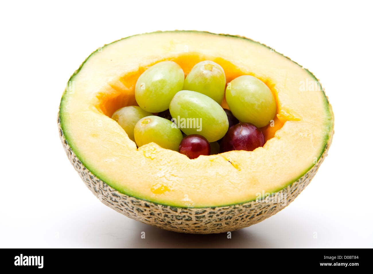 Melon with grapes Stock Photo - Alamy