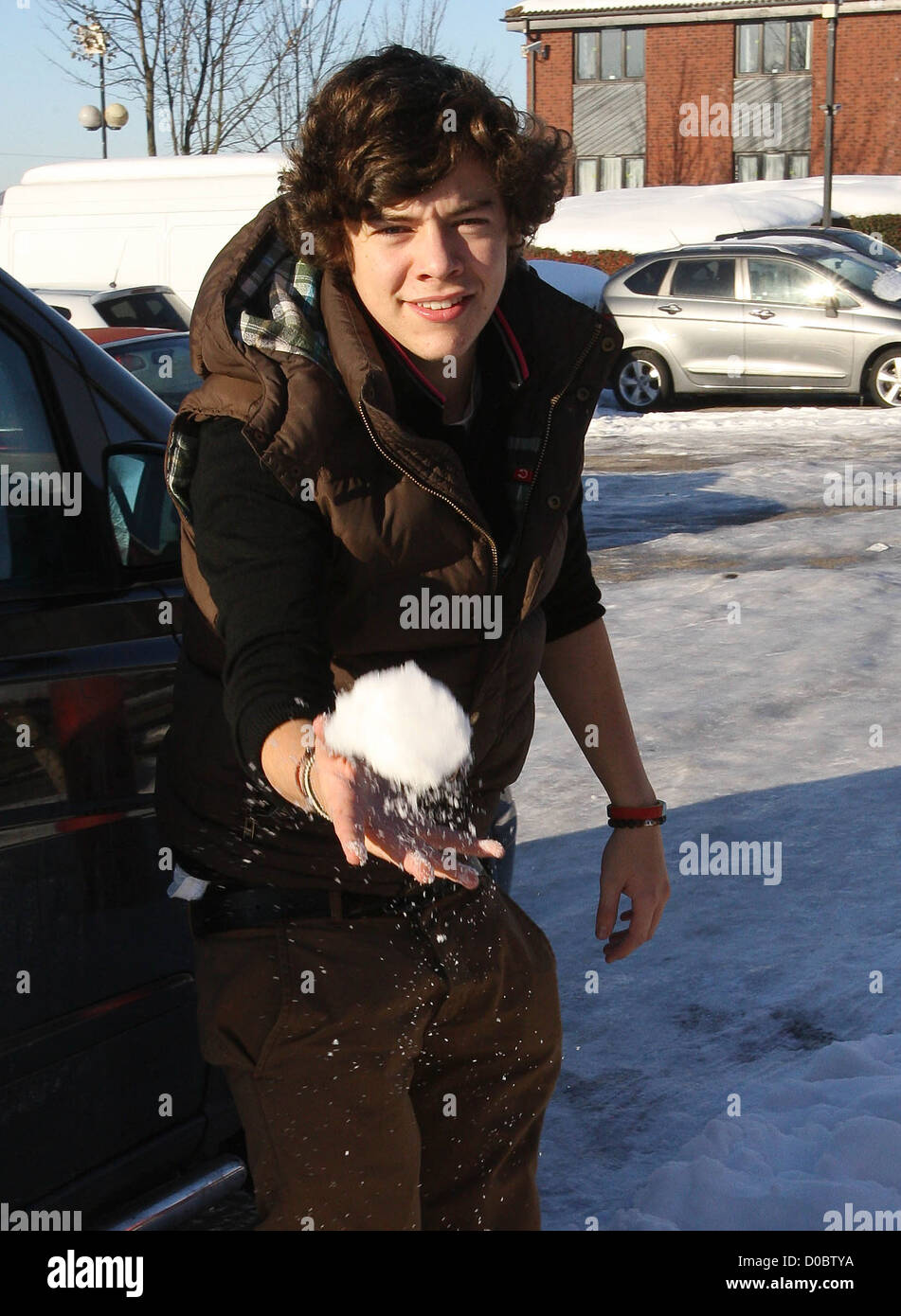 Harry Styles of One Direction throws a sw ball while arriving at Little ...