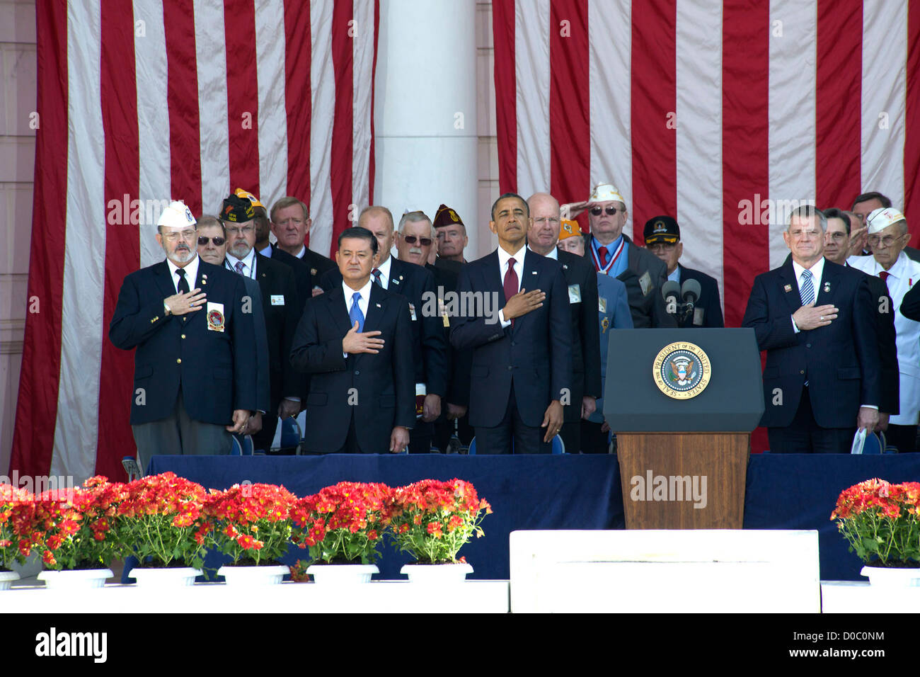 US President Barack Obama says the pledge of allegiance at Arlington ...