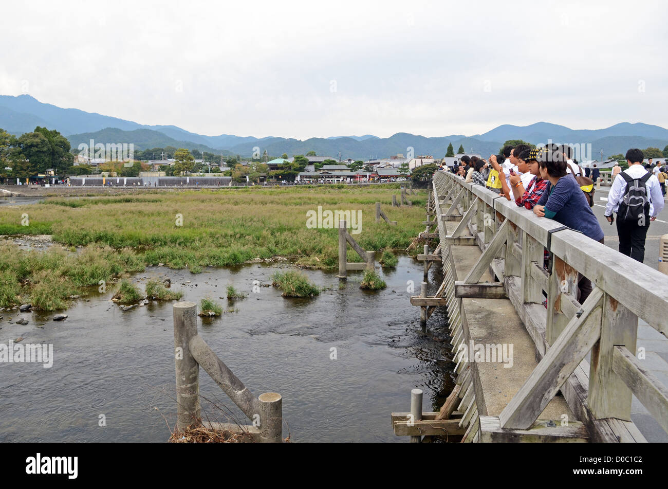 Moon crossing bridge in Arashiyama Stock Photo - Alamy