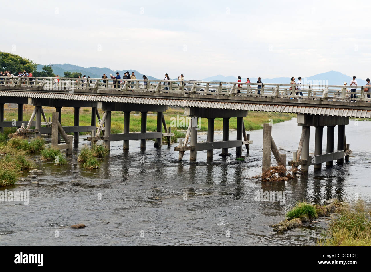 Moon crossing bridge in Arashiyama Stock Photo - Alamy