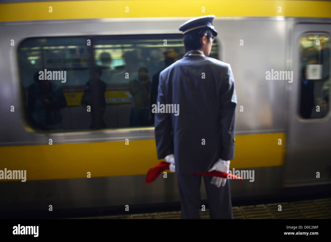 Train station worker, Tokyo Stock Photo - Alamy