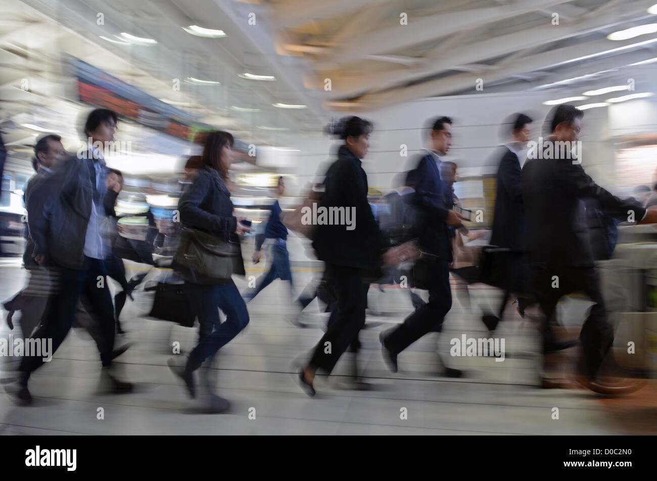 Thousands of businessmen using subway and train services during Rush ...