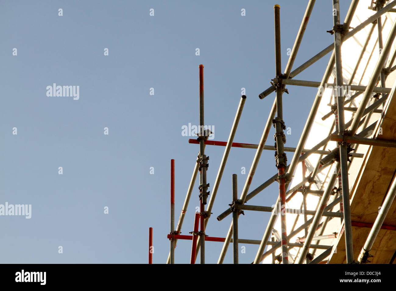 scaffolding against clear blue sky Stock Photo - Alamy
