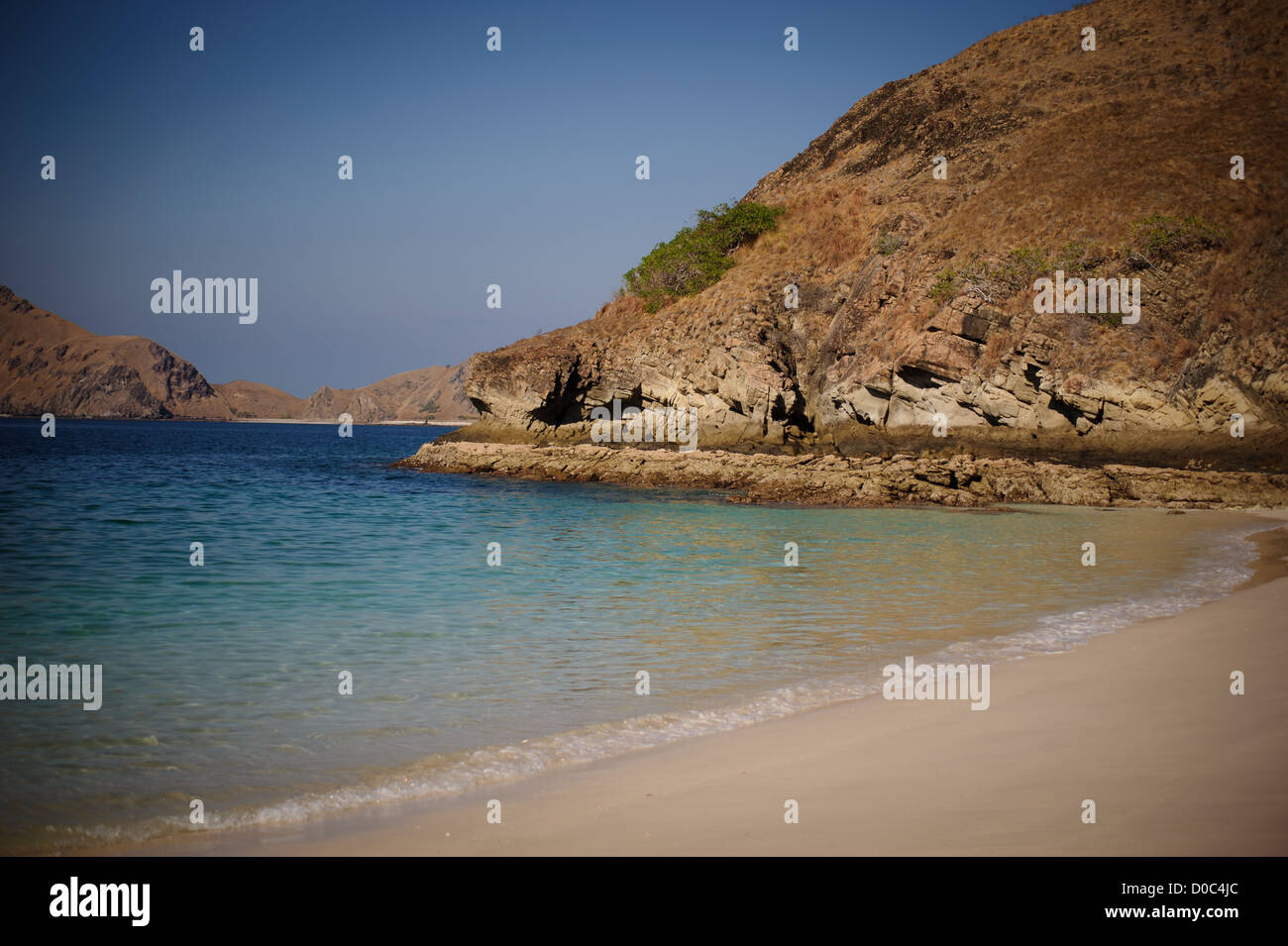 one of the beach of Padar Island in a perfect sunny day with blues sky ...