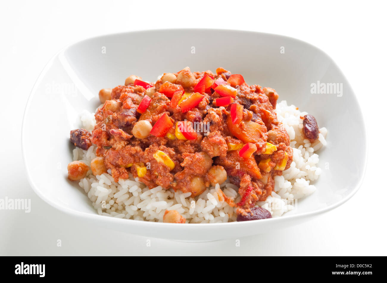 Rice with chili con carne and red chili peppers Stock Photo - Alamy