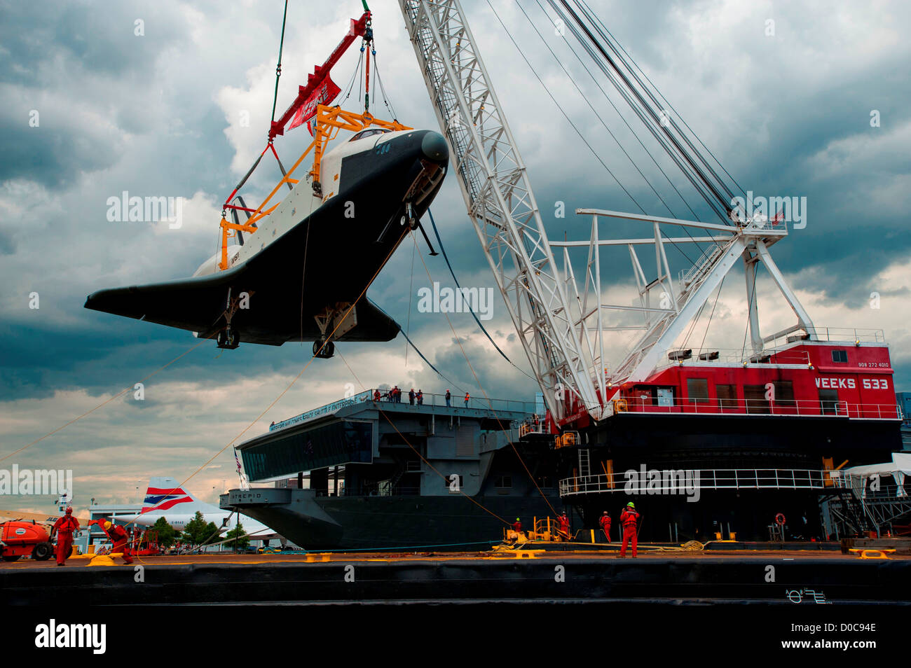 Space Shuttle prototype Enterprise is lifted onto deck USS Intrepid Sea ...