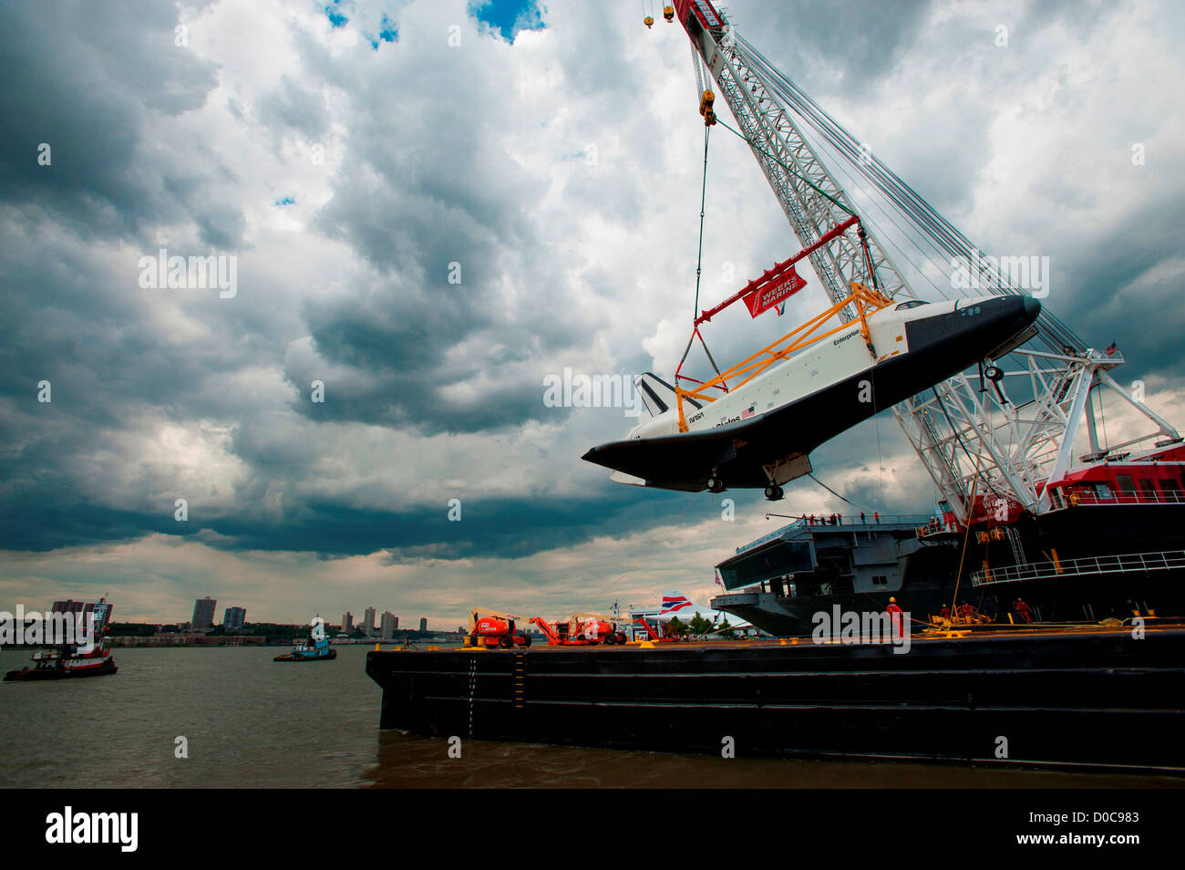 Space Shuttle prototype Enterprise is lifted onto deck USS Intrepid Sea ...