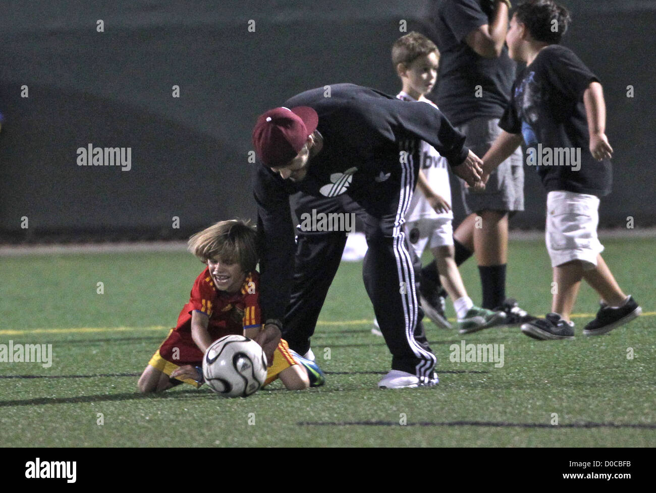 David Beckham with his son Romeo David Beckham plays ball with his two ...