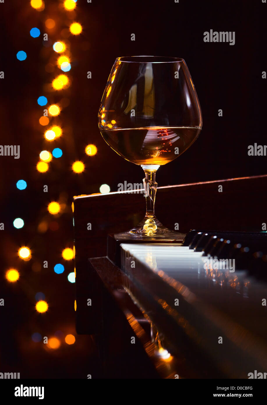 Gratitude for the maestro, snifter with brandy on a piano Stock Photo ...