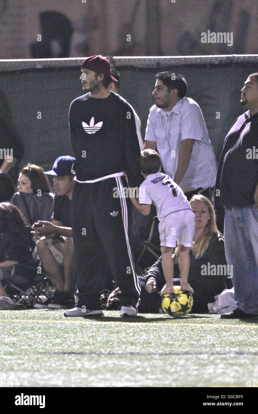 David Beckham stands on the side lines as he watches Brooklyn Beckham's ...