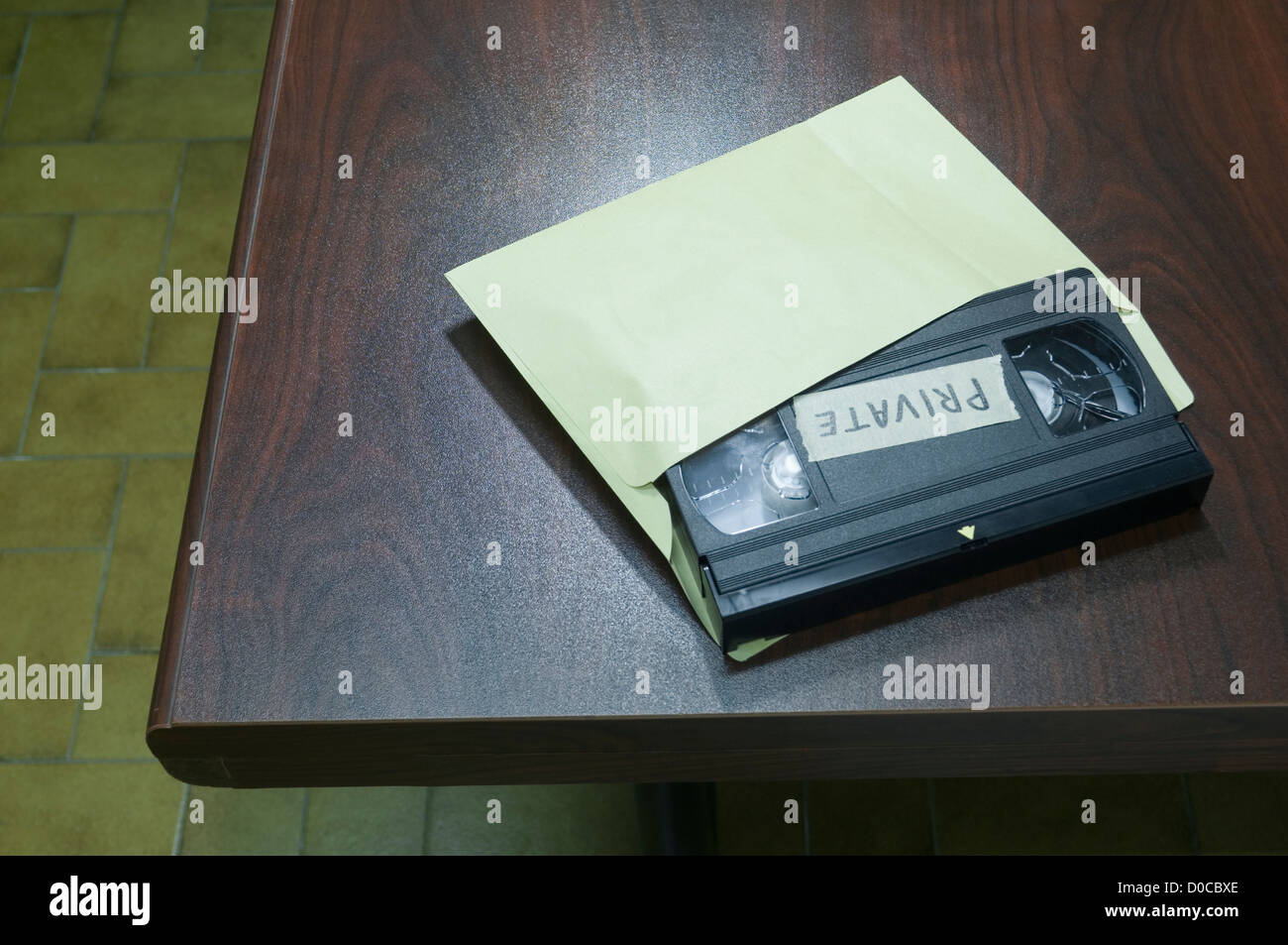 Vhs tape outside envelope on desk Stock Photo - Alamy
