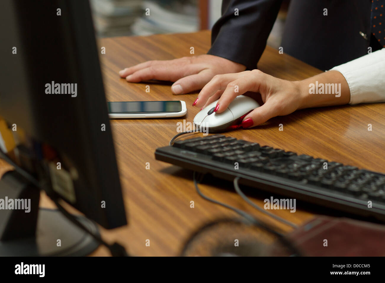 Office workers doing their job on a pc computer Stock Photo - Alamy