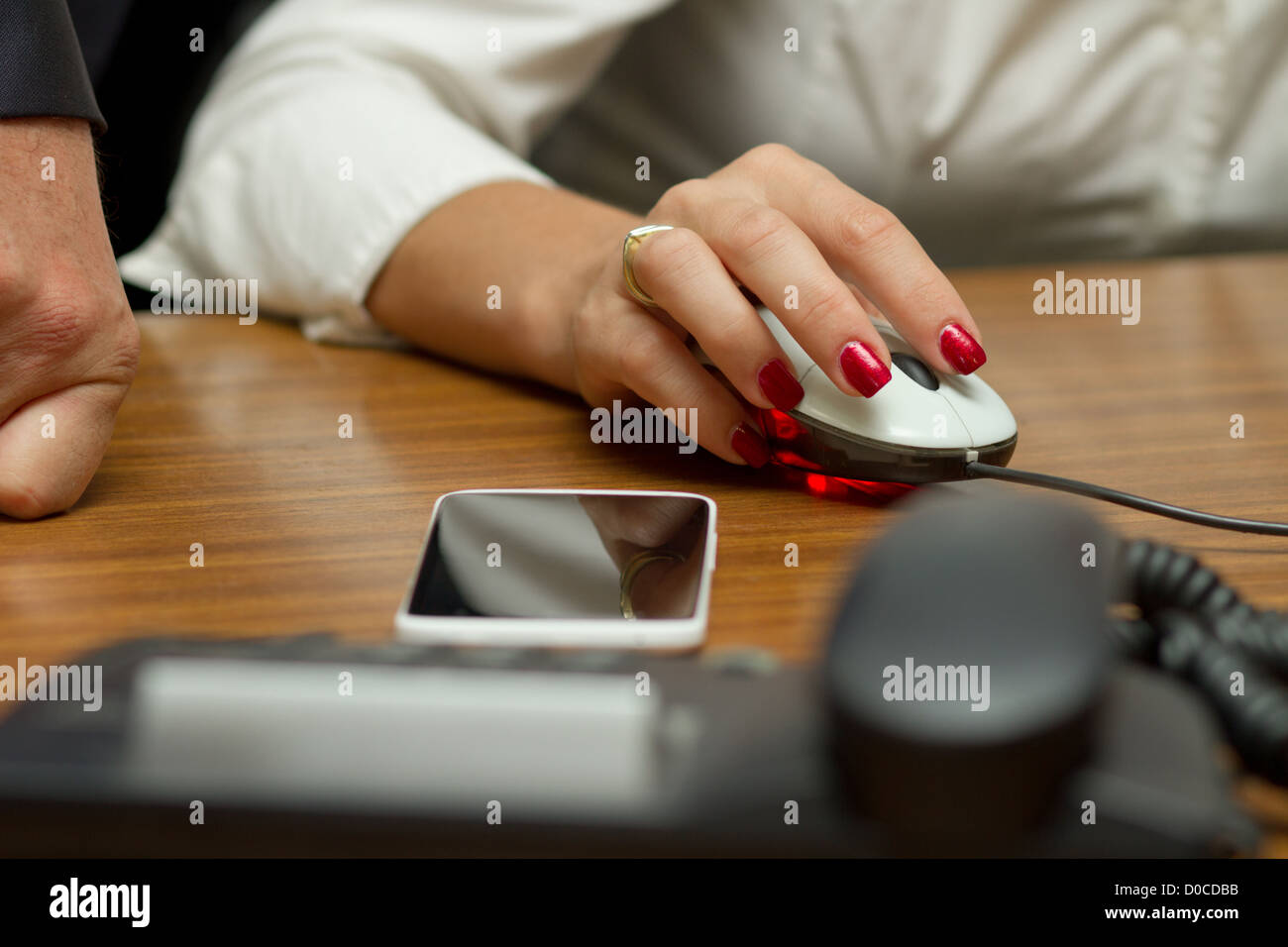 Hands of office worker holding a pc mouse Stock Photo - Alamy