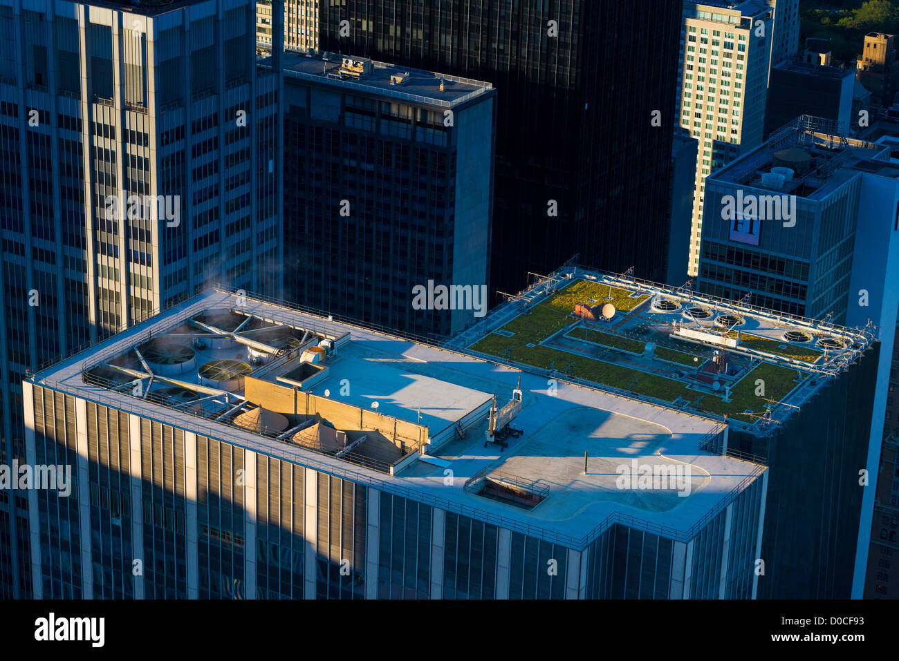 Manhattan skyscrapers roofs with fans, and steam, New York Stock Photo ...